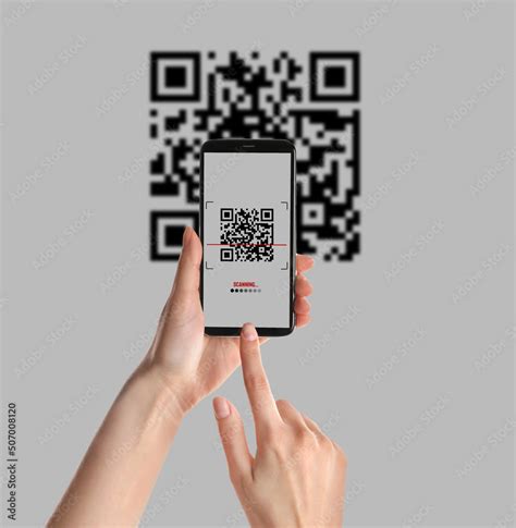 Woman Scanning Qr Code With Smartphone On Light Background Closeup