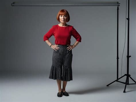 A Middleaged Woman With Red Skin And Bob Cut Standing0 Premium Ai