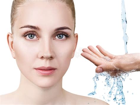 Woman Face And Pouring Water In Hand Moistening Concept Stock Image