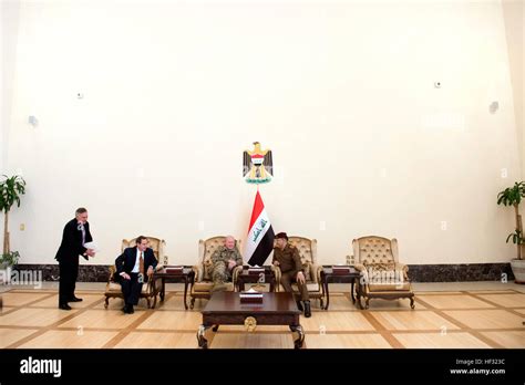 A Senior Iraqi Military Officer Waits With Us Chairman Of The Joint