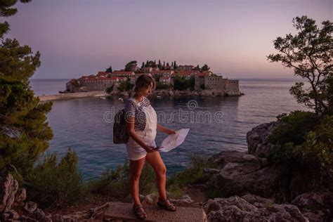 Middle Aged Pregnant Woman In Vest Holds Map Phone In Hands Travel