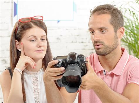 Premium Photo Close Up Of Couple Using Camera At Home