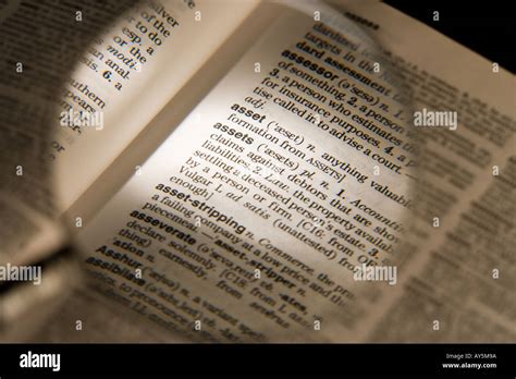 magnifying glass on dictionary page showing definition of the word