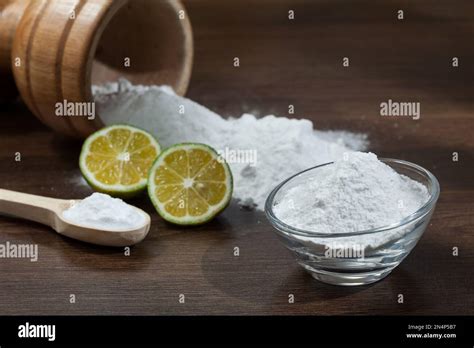 Baking Soda Sodium Bicarbonate And Lemon On Dark Wooden Background Stock Photo Alamy