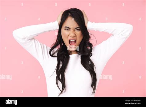 Image Of Young Brunette Asian Woman In Casual Clothes Screaming And