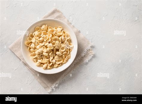Fresh Raw Orecchiette Pasta Made From Whole Wheat Flour In Bowl On