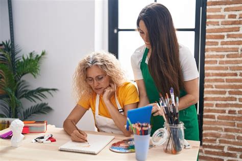 Premium Photo Two Women Artists Using Touchpad Drawing At Art Studio