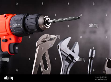 Composition With Different Kinds Of Hardware Tools Including Cordless Drill Monkey Spanner And
