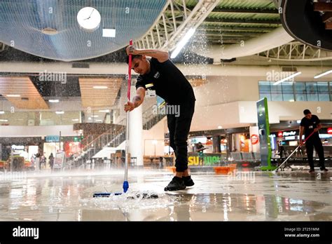 Staff Sweep Away Water From Inside Faro Airport In Portugal After Heavy