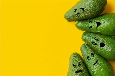 Premium Photo Avocado Emoji On Yellow Background Copy Space
