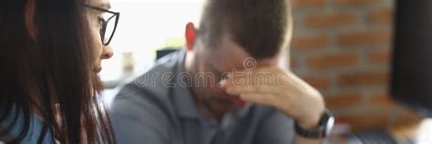 Businesswoman Pointing At Time To Latecomer Colleague Stock Image