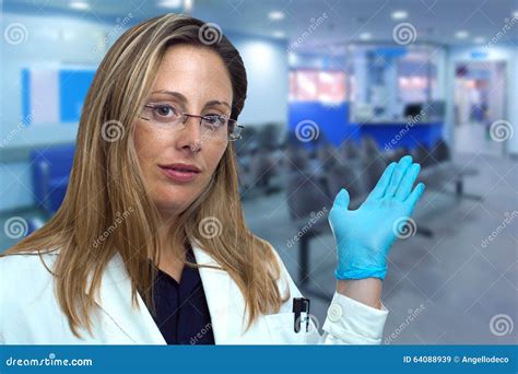 Doctor Woman Presenting And Showing The Entrance To The Corridor Stock