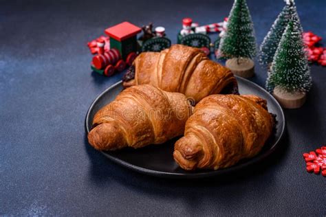 Crispy Chocolate Croissant With Christmas Decorations On Wooden Cutting