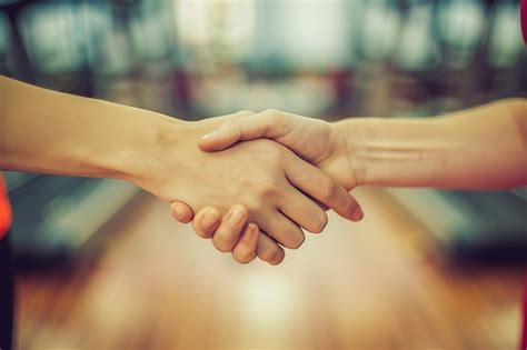 Premium Photo Handshake Between Trainer And Trainee At A Fitness Class