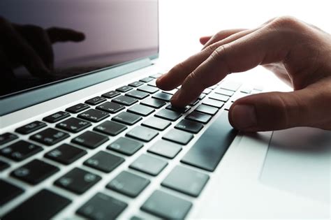 Premium Photo Hand Typing On Keyboard On Modern Laptop