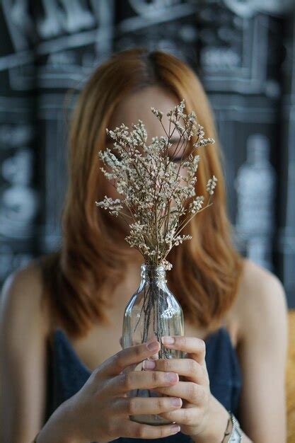 Premium Photo Woman Holding Flower