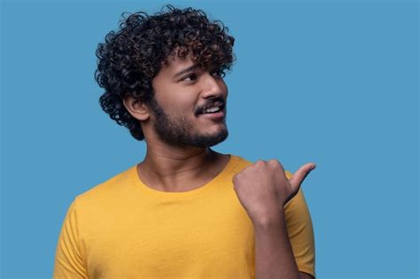 Premium Photo Portrait Of A Smiling Pleased Dark Haired Man With The