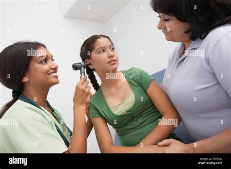 Girl Having Medical Examination At Doctors Stock Photo Alamy