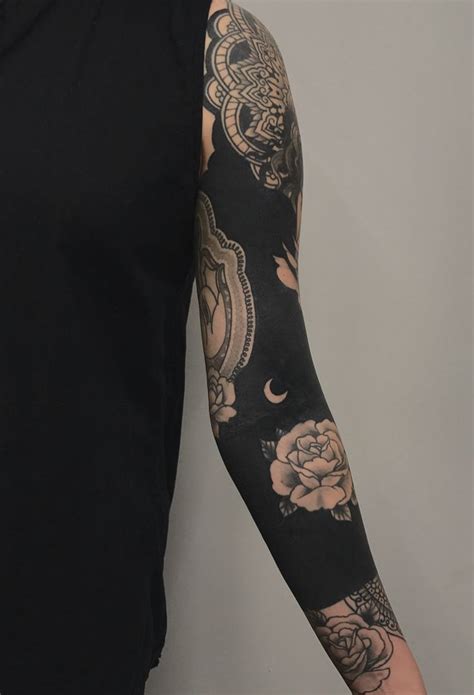 These Striking Solid Black Tattoos Will Make You Want To Go All In
