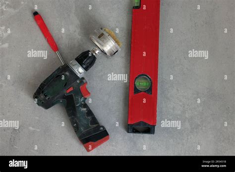 Buffing Attachment Drill And Building Level On Floor Flat Lay Tiles