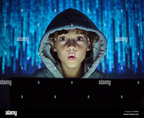 Amazed Preteen Programmer Kid With Laptop On Blurred Binary Code