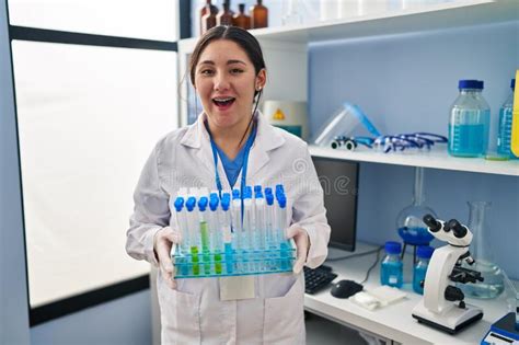 Young Latin Woman Working At Scientist Laboratory Smiling And Laughing