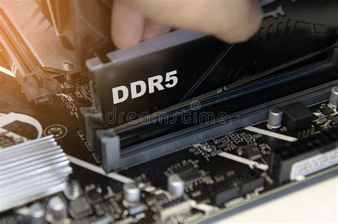 The Technician Is Installing Ddr5 Ram Onto The Motherboard Stock Image