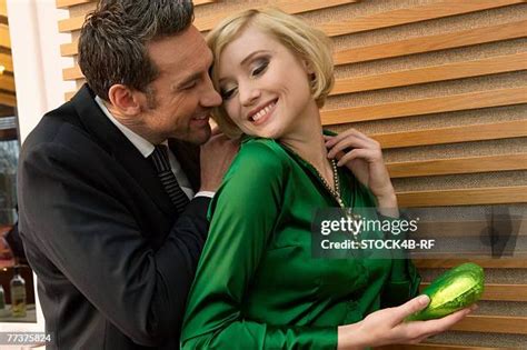 Man Putting Necklace On Woman Photos And Premium High Res Pictures