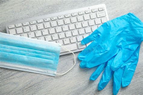 Medical Mask Gloves And Computer Keyboard On The Table Stock Image