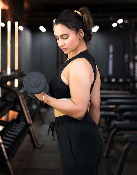Premium Photo Indian Fitness Model In Gym With Dumbbell Doing Bicep Curls