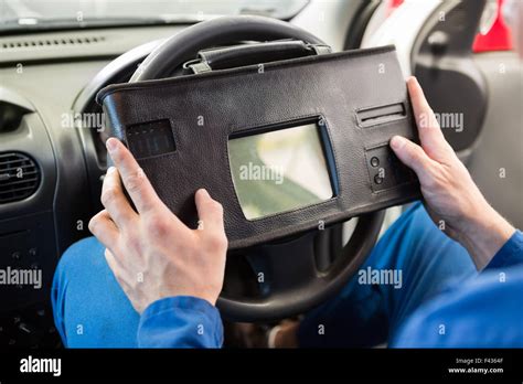 Mechanic Using Diagnostic Tool In The Car Stock Photo Alamy