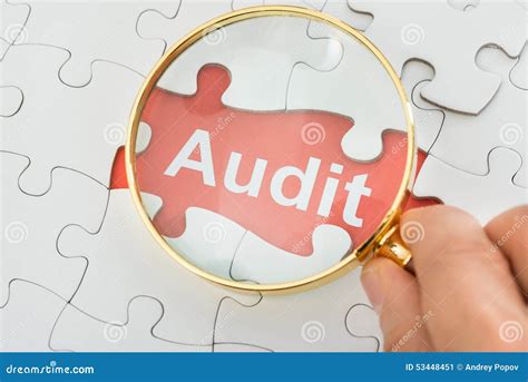 Person Holding Magnifying Glass Over Audit Text Stock Image Image Of