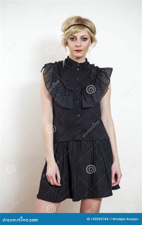 Attractive Fashion Indoor Portrait Of Beautiful Blonde Girl Posing In