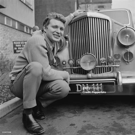 English Actor Derren Nesbitt Pictured Crouching By The Front Grille