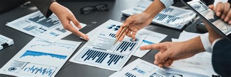 Premium Photo Analyst Team Analyzing Business Data Paper On Office