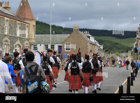 Pipe And Drums Bands Street Parade Pipers And Drummers Playing And