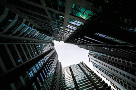 Low Angle Shot Of Modern Glass City Buildings With Clear Sky Background