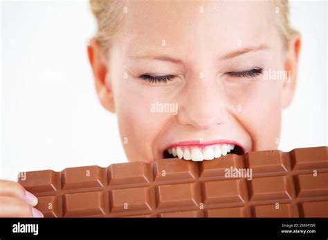 I Cant Resist Anymore Crazed Young Woman Biting Into A Huge Piece Of