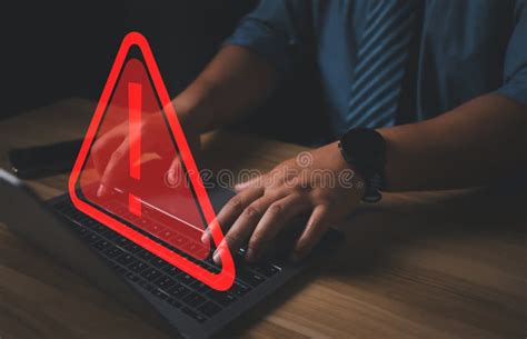 Hacker Or Programmer Using Laptop With Triangle Caution Warning Sign