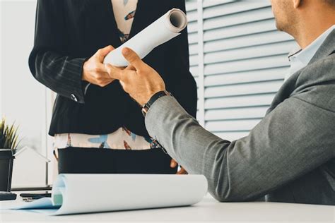 Businessman Get Finished Work From Businesswoman Uds Premium Photo