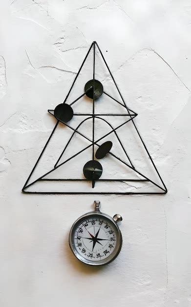 Premium Photo Top View Of Triangle And Compass On White Wall