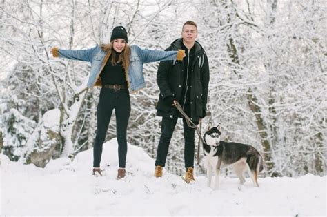 Premium Photo Couple With Huskies