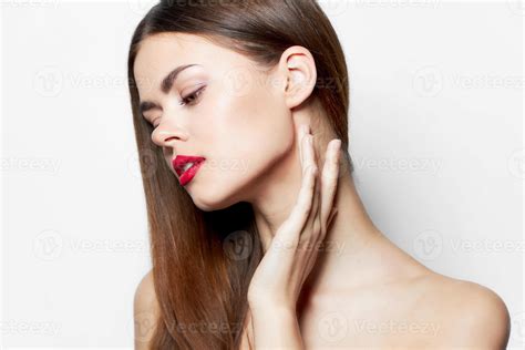 Woman Touches Her Neck With Her Hand With Long Hairstyle Lipstick