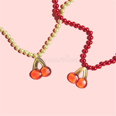 Pearl Necklaces Arranged With Cherry Fruit Gummy Candy Stock Image