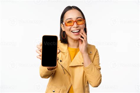 Enthusiastic Asian Female Model Showing Smartphone App Interface Online Store Or Website On