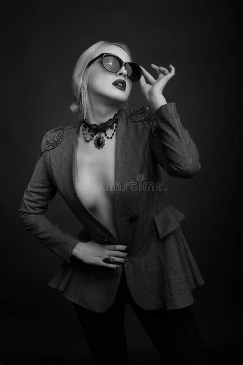 Monochrome Studio Portrait Of A Lovely Blond Woman Wears Sunglasses And