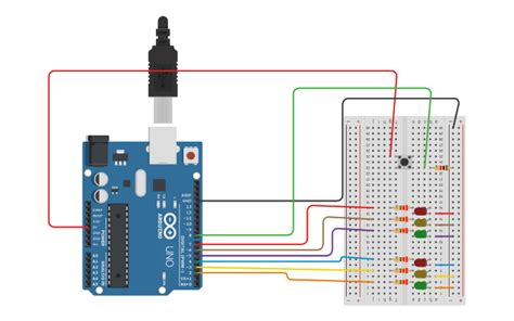 circuit design simulazione di un semaforo con pulsante tinkercad