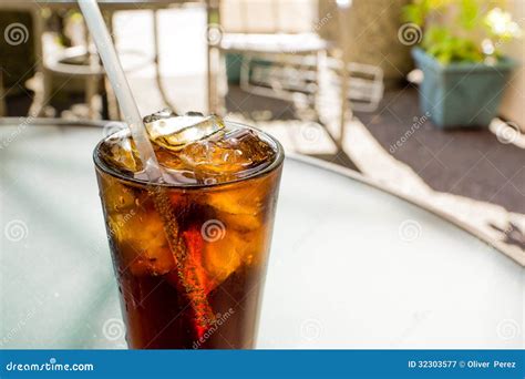 A Cold Drink With Fruit Pieces Of Fruit And Citrus A Spray Flying
