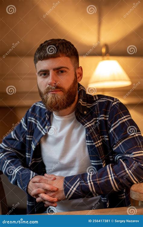 Portrait Handsome Bearded Man Wearing Plaid Shirt At Modern Cafe Stock