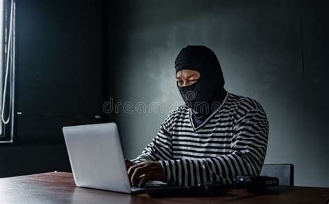 Thief Use Computer For Theft Hacker Stealing Data From A Laptop